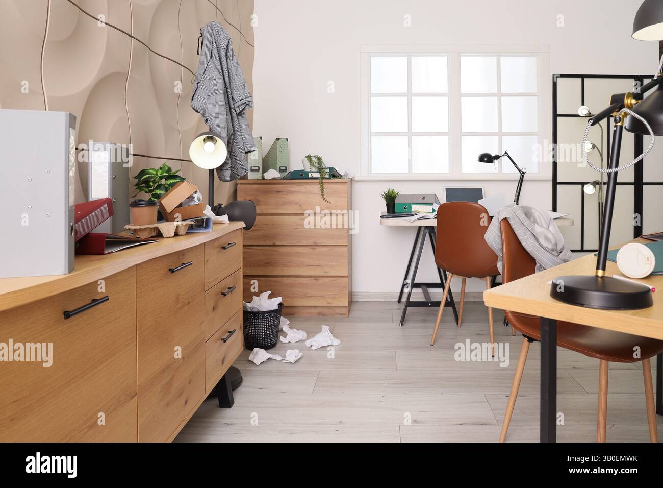 Interior of messy office with drawers, desks and garbage Stock Photo ...