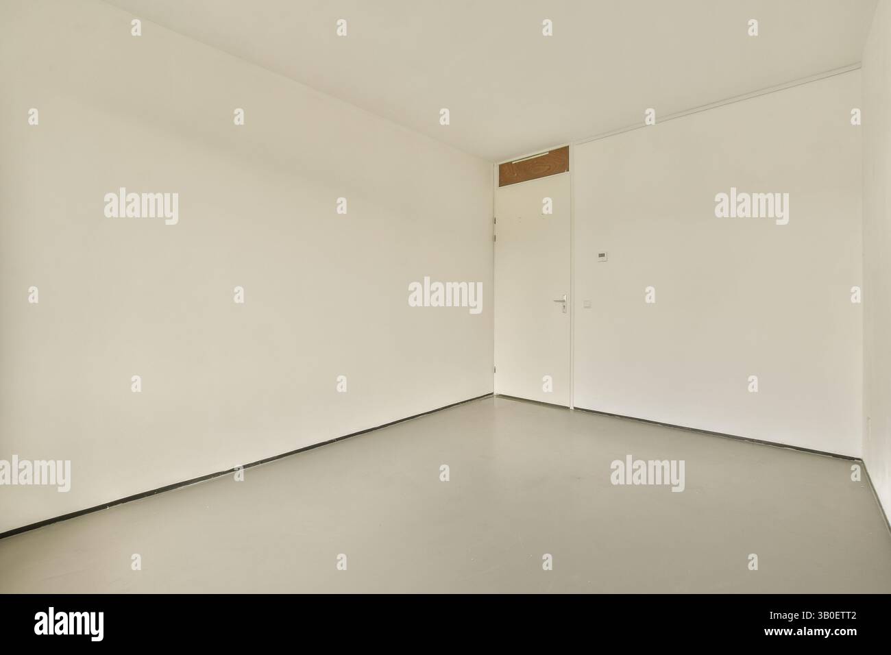 A pristine, empty room characterized by its minimalist design and ...