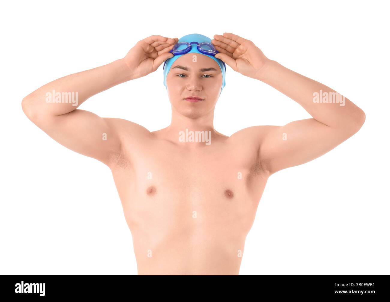 Male swimmer putting on goggles against white background Stock Photo ...