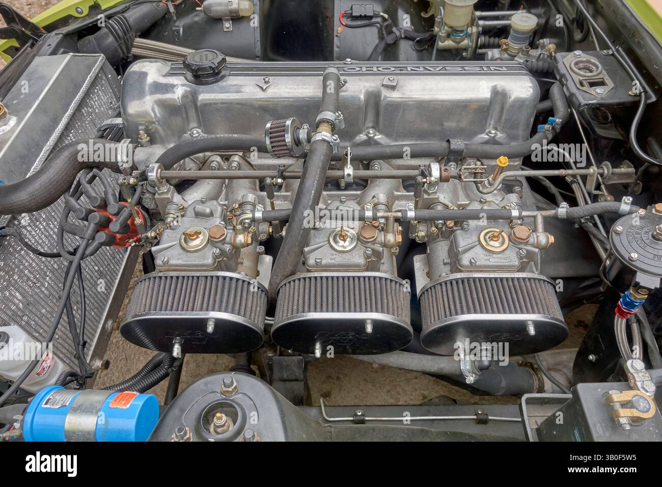 Datsun 240Z car engine with modified triple Weber carburetors. Modified ...