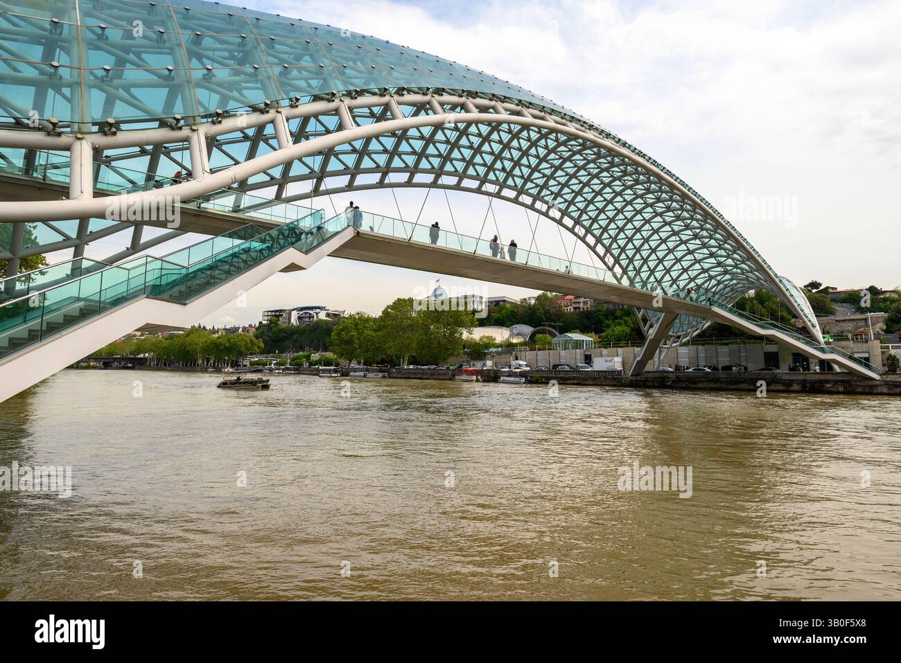 Peace bridge, steel and glass construction pedestrian bridge over Kura ...