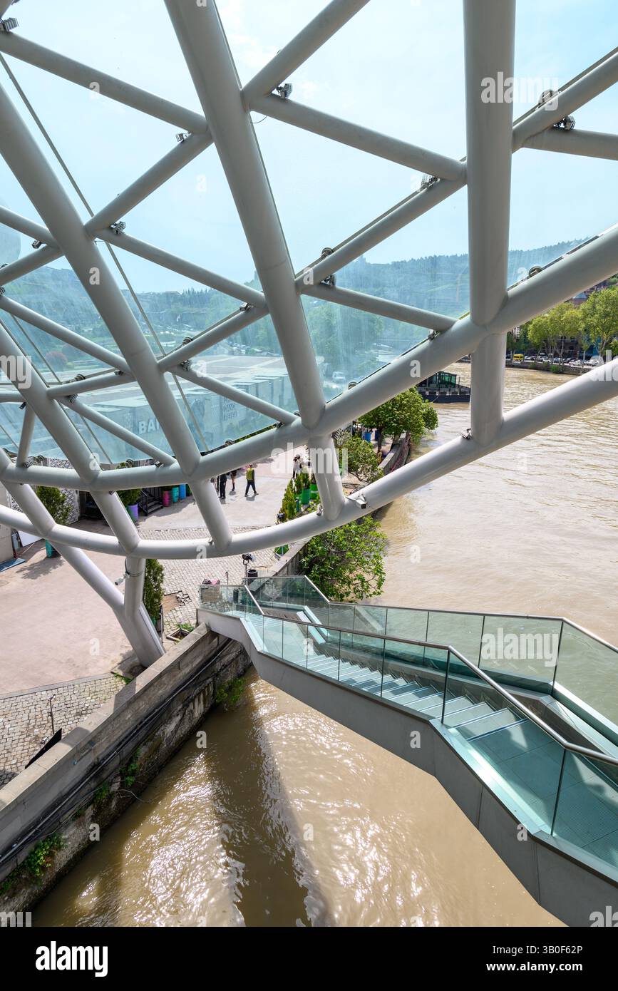 Peace bridge, steel and glass construction pedestrian bridge over Kura ...