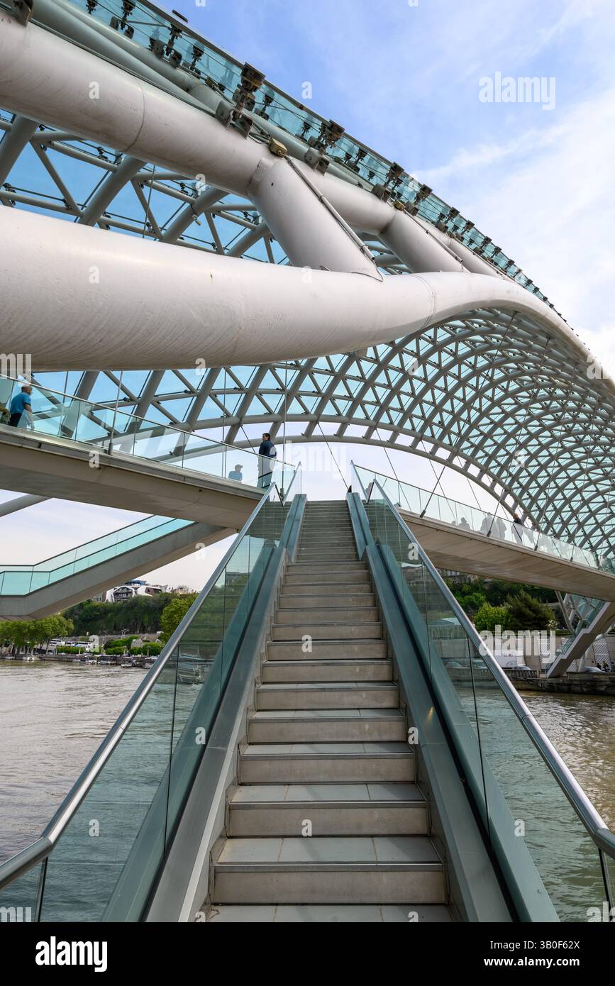 Peace bridge, steel and glass construction pedestrian bridge over Kura ...