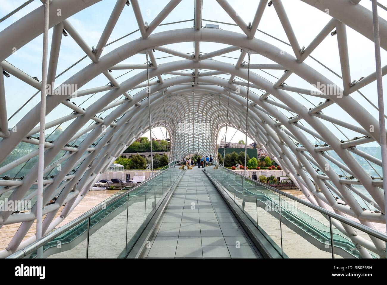Peace bridge, steel and glass construction pedestrian bridge over Kura ...