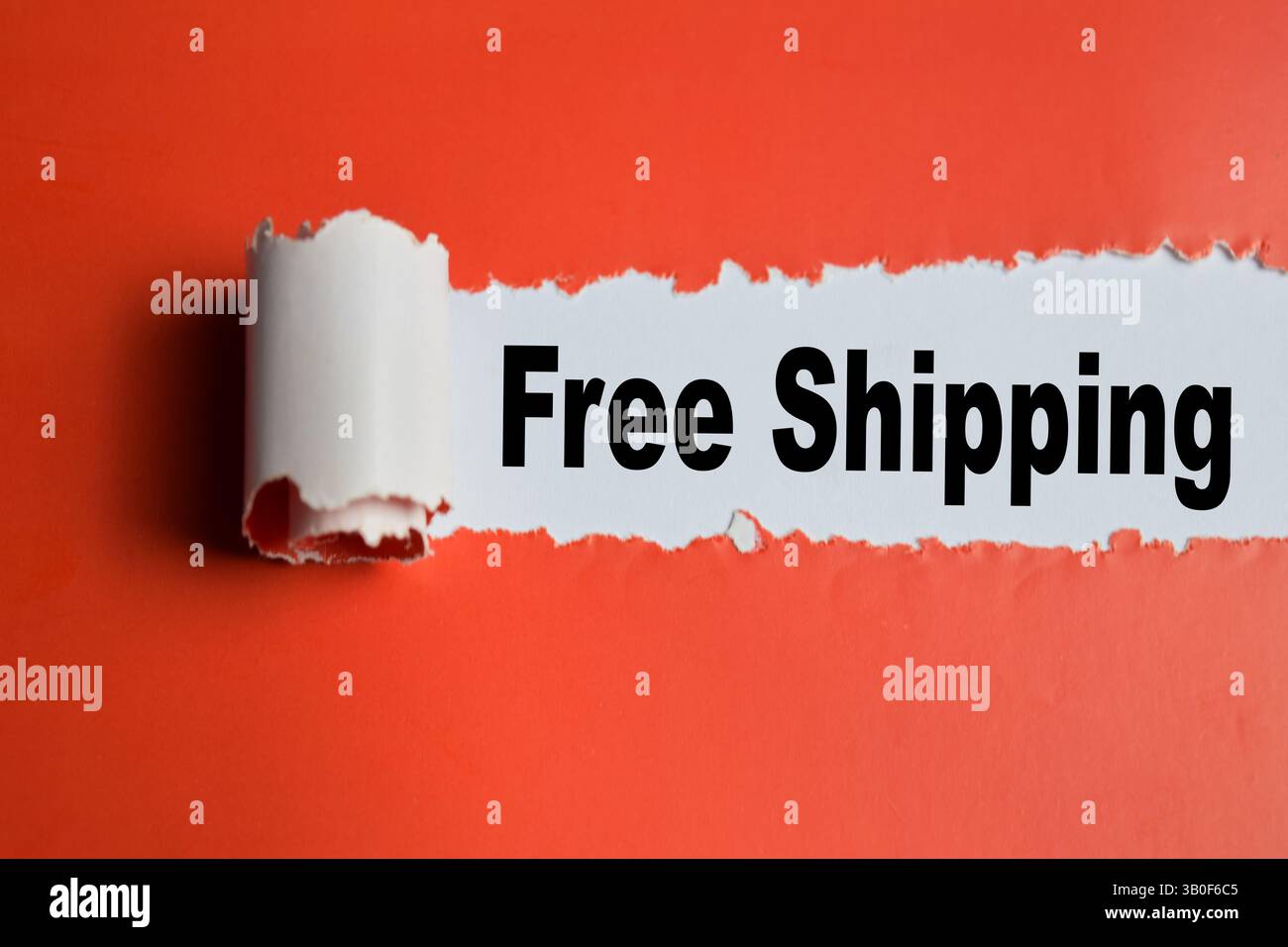 The Free shipping Text written in torn paper Stock Photo - Alamy