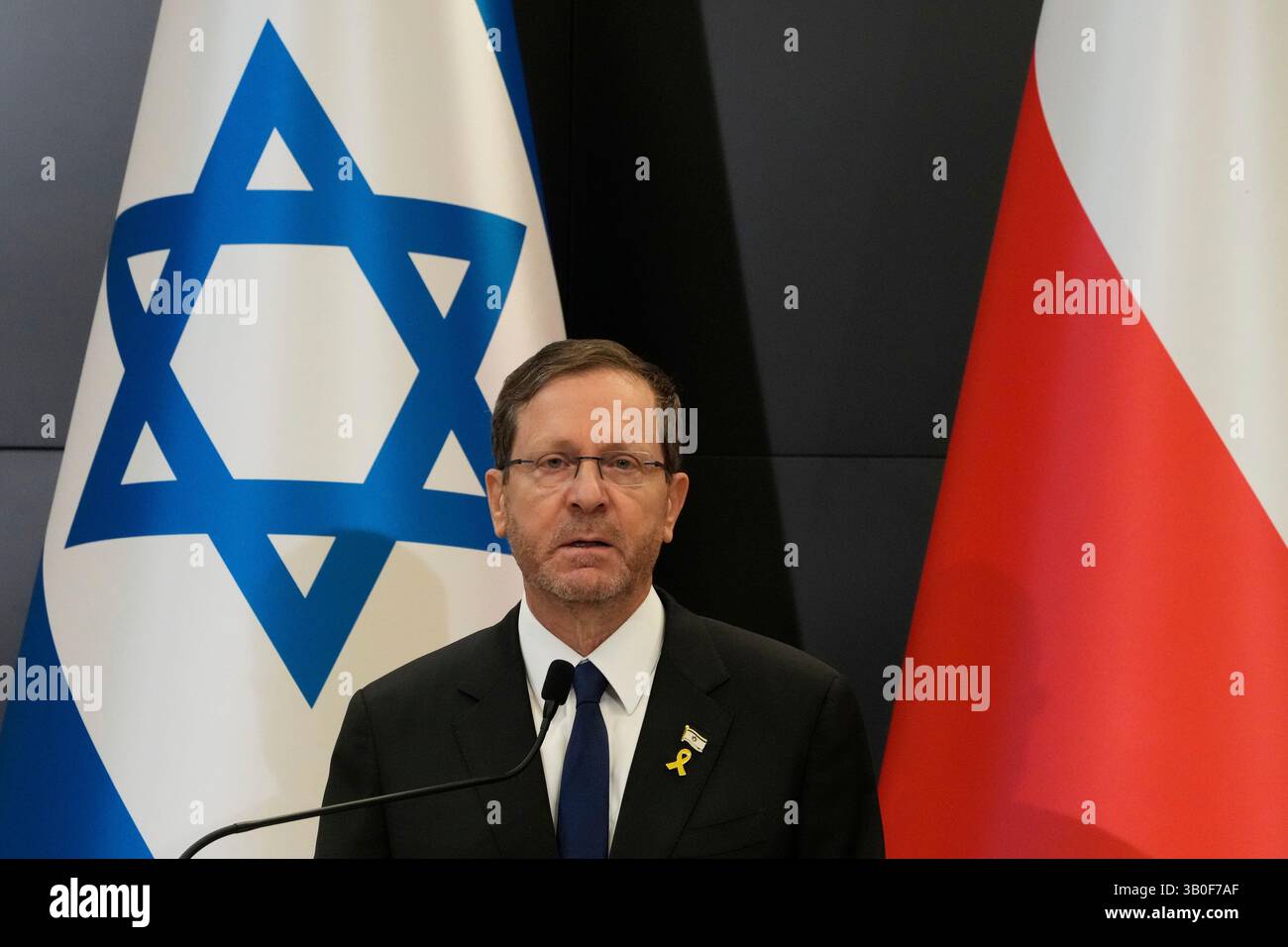 Israel's President Isaac Herzog holds a statement to media in Oswiecim ...