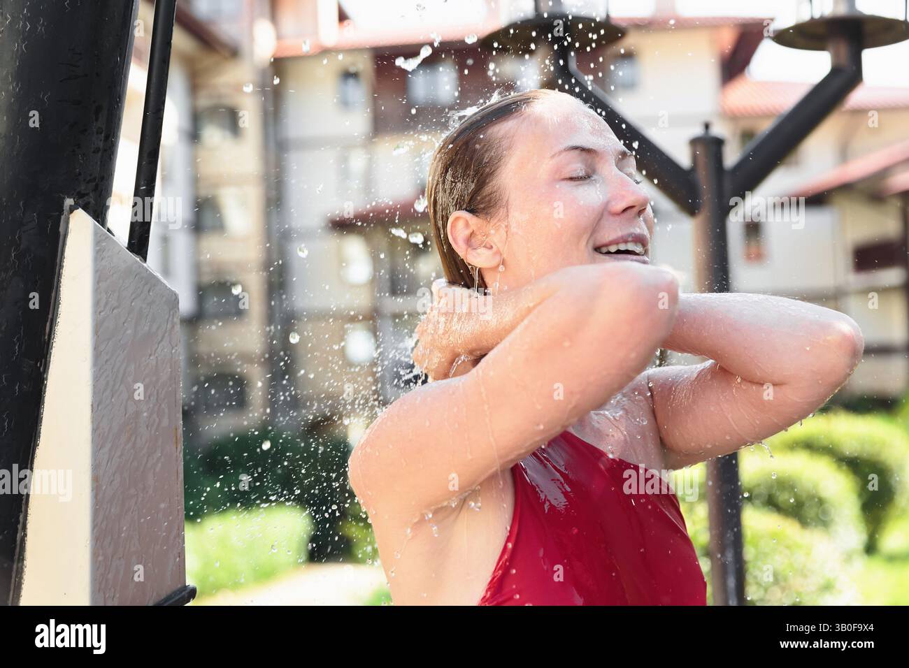 Resort Woman Showering in Cold Water Outside Stock Photo - Alamy