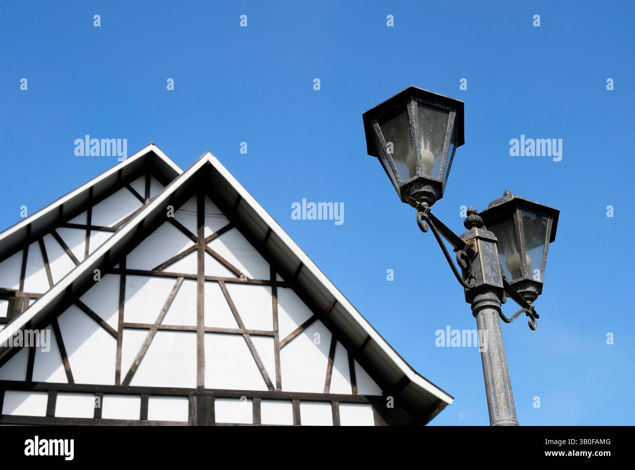 Aesthetic street lights and house against the blue sky Stock Photo - Alamy