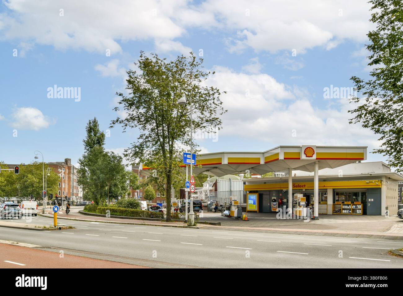 A Shell gas station prominently positioned in an urban area, featuring ...