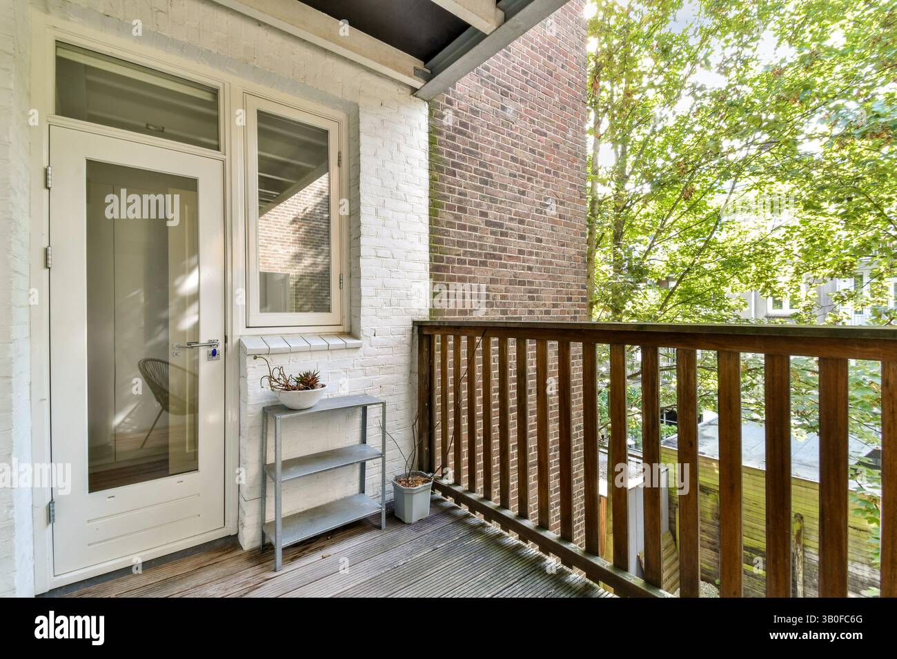 A contemporary balcony design showcasing a blend of wooden and white ...
