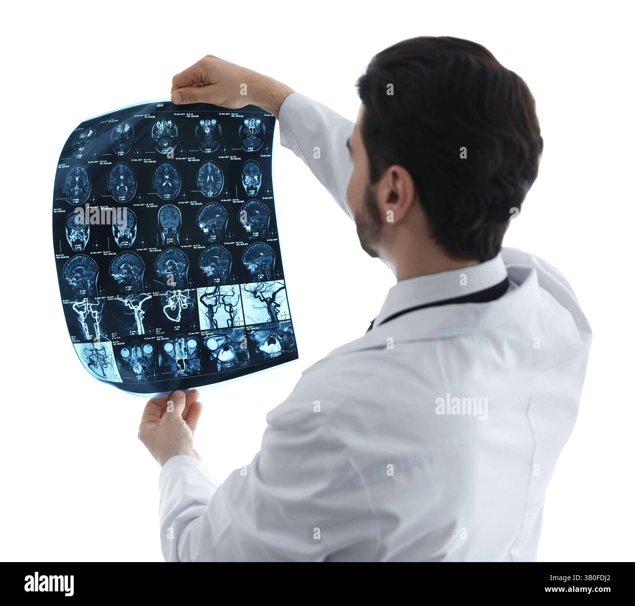 Doctor examining brain MRI scan on white background, back view Stock ...