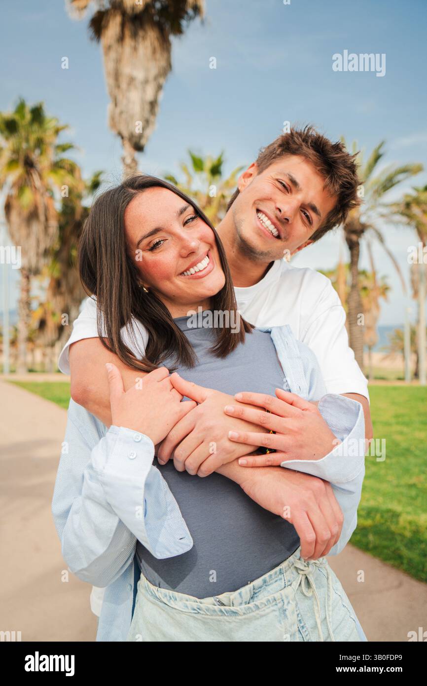 A delightful couple enjoying a loving hug, radiating happiness and ...