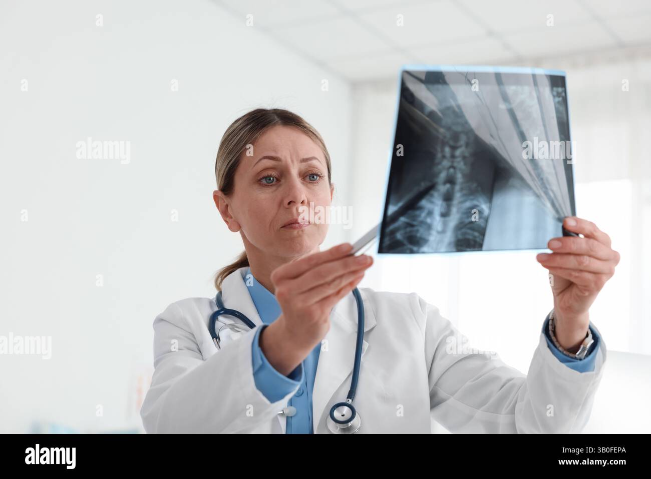 Doctor examining neck MRI scan in hospital Stock Photo - Alamy