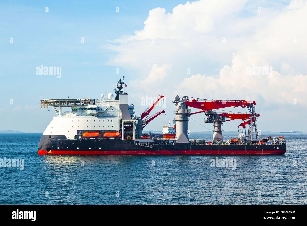 Multi-purpose supply vessel is anchored in a sea bay Stock Photo - Alamy