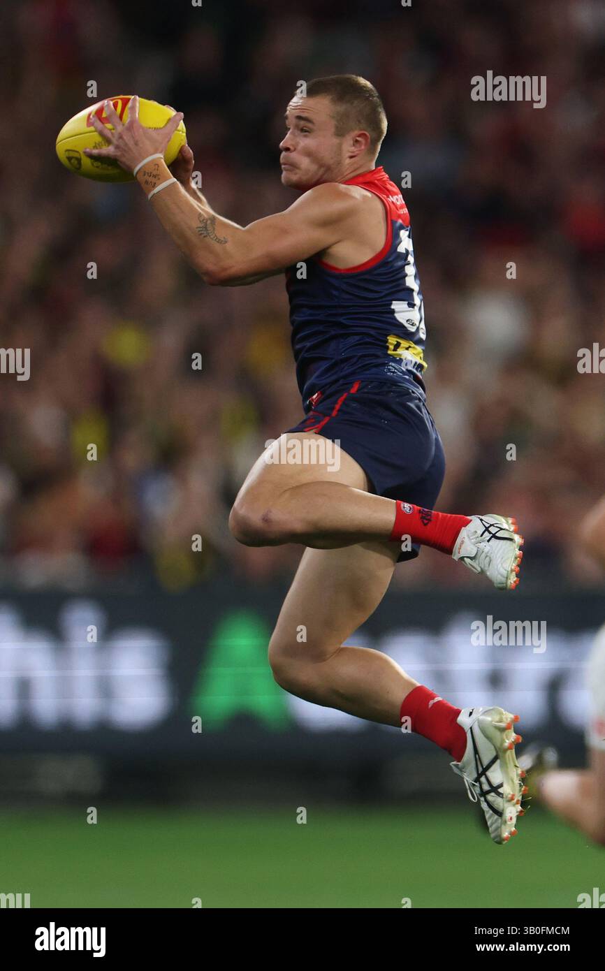 Melbourne, Australia. 24th Apr, 2025. Kade Chandler of the Demons marks ...