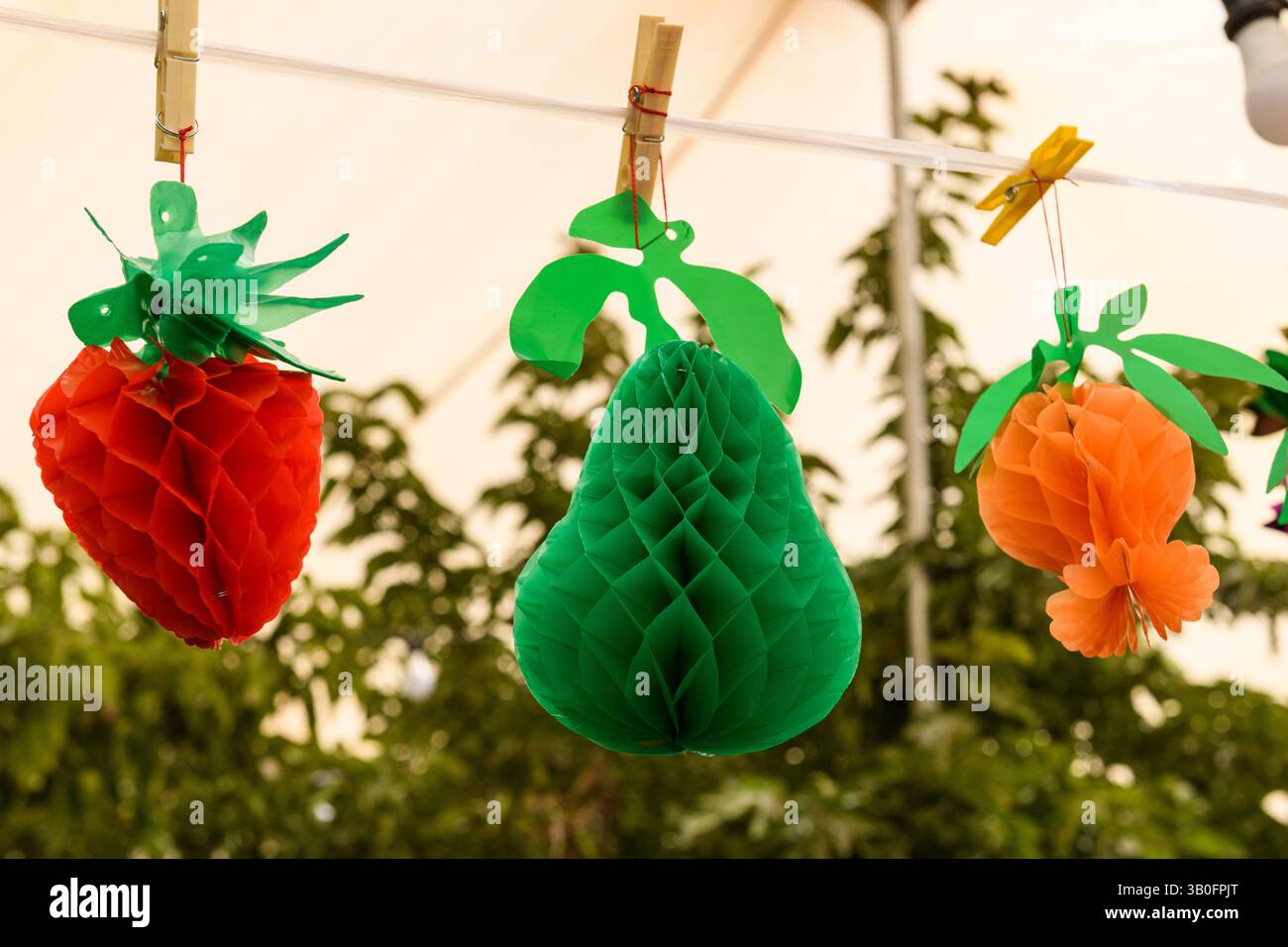 Colorful, paper fruit sculptures sold for decorating the sukkah, a ...
