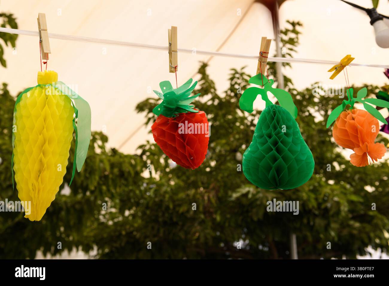 Colorful, paper fruit sculptures sold for decorating the sukkah, a ...