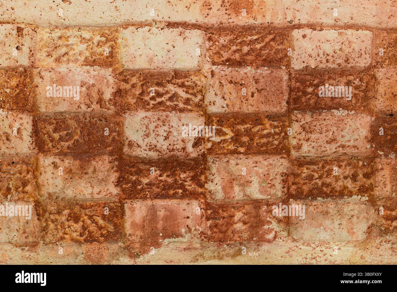 Textured, patterned stone wall in the design of an abstract ...