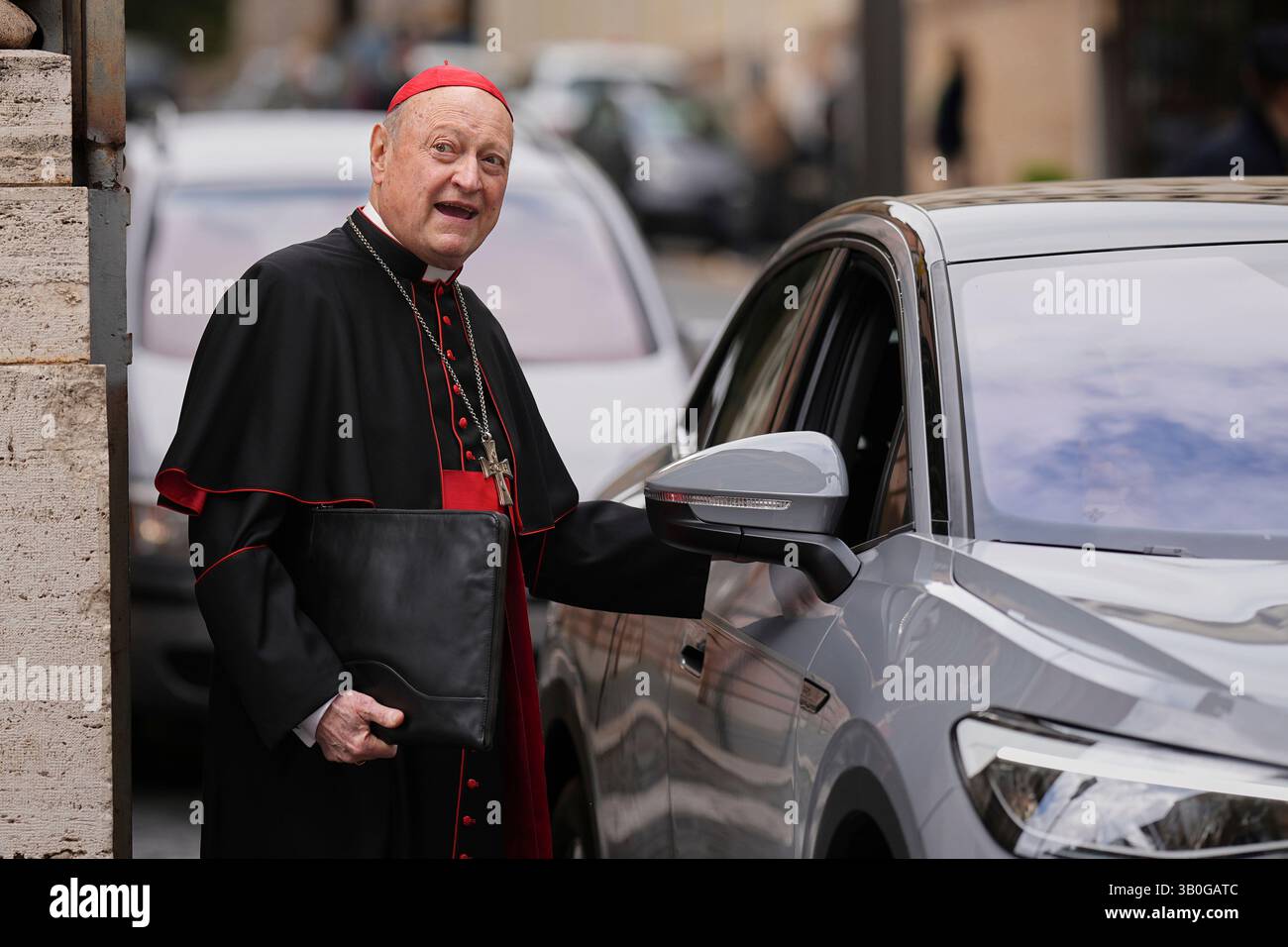Cardinal Gianfranco Ravasi boards a vehicle at the Vatican, Thursday ...