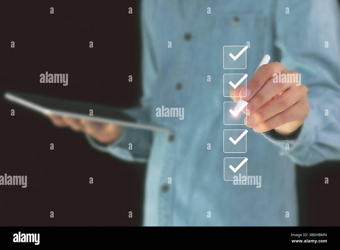 Checklist concept. Businessman is marking checkboxes Stock Photo - Alamy