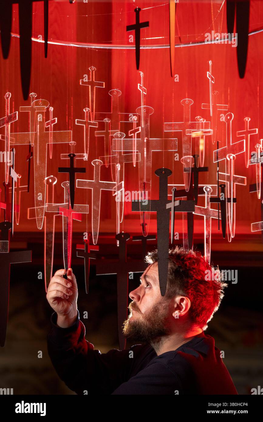 David McLeod puts the finishing touches to an installation featured in ...