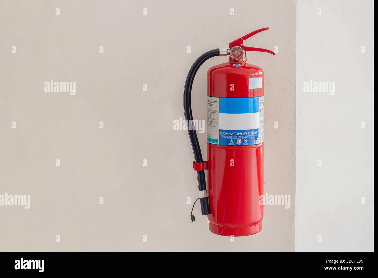 The red fire extinguisher is ready for use in case of an indoor fire ...