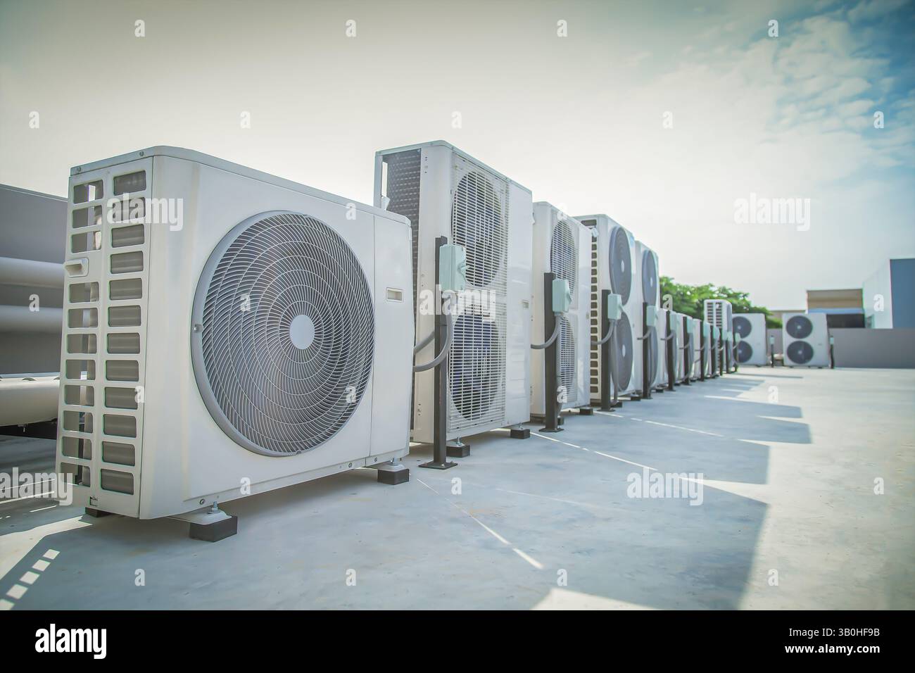Air conditioning (HVAC) on the roof of an industrial building with blue ...