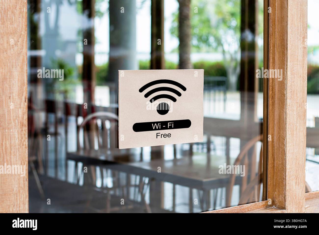 free Wi-Fi sign is posted on the glass door in front of the restaurant ...