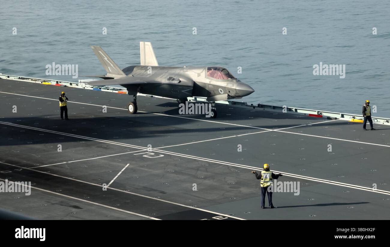 A F35 fighter lands on the deck of HMS Prince of Wales, the Royal Navy ...