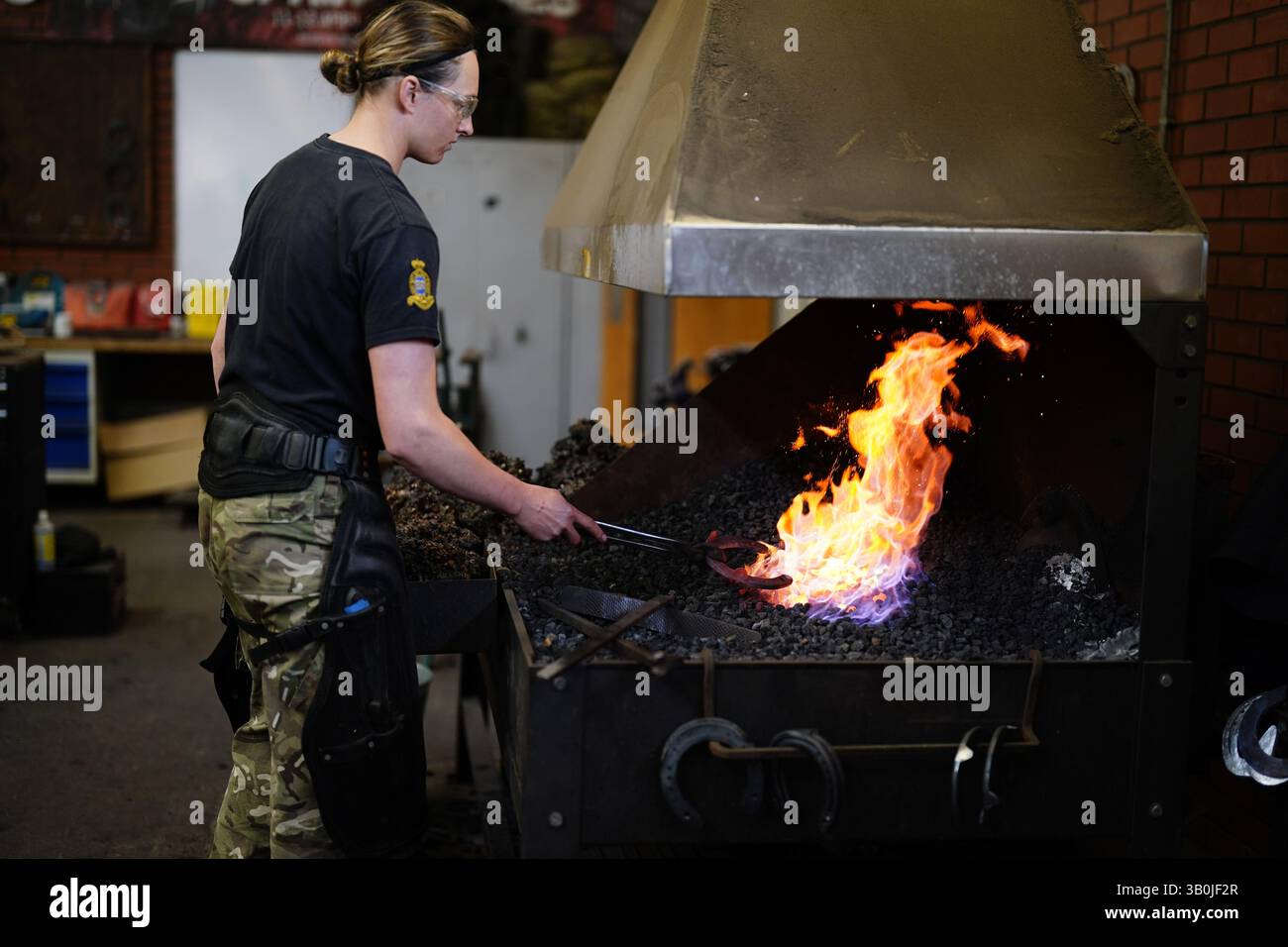 A horseshoe is made in the forge as members of The King's Troop, Royal ...