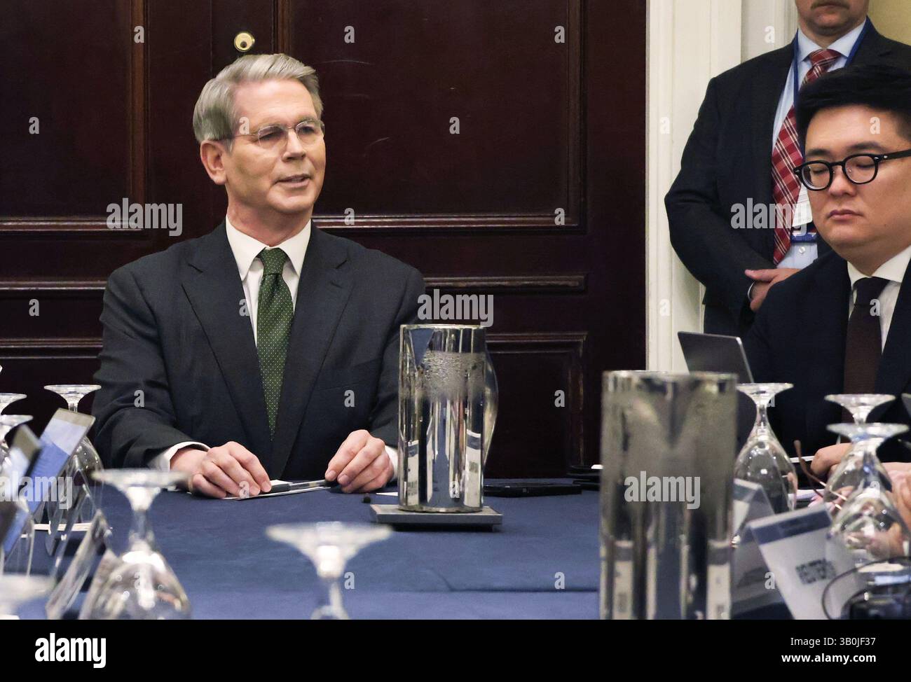 U.S. Treasury Secretary Scott Bessent (L) meets the press in Washington ...