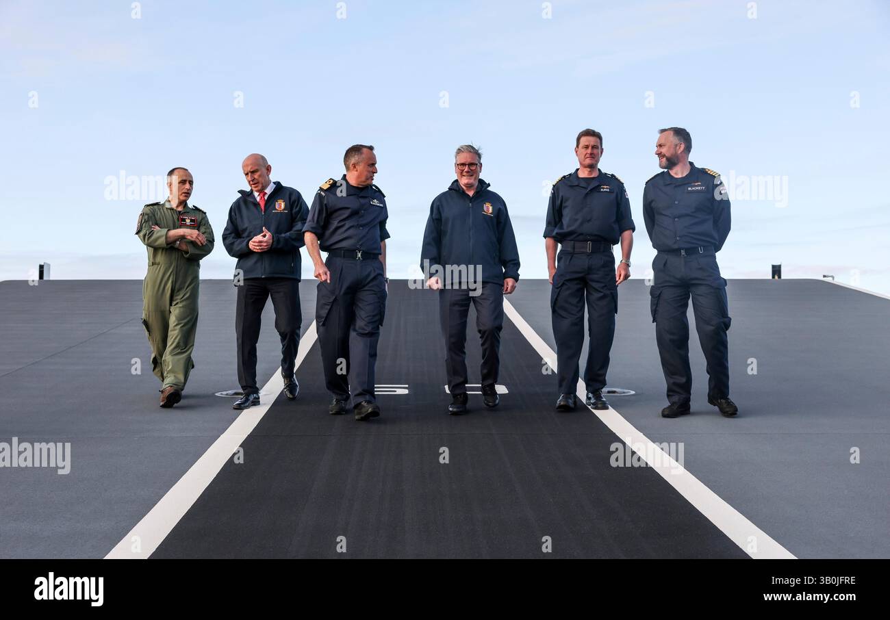 From left, Captain Colin McGannity (RN) Commander of the Carrier air ...