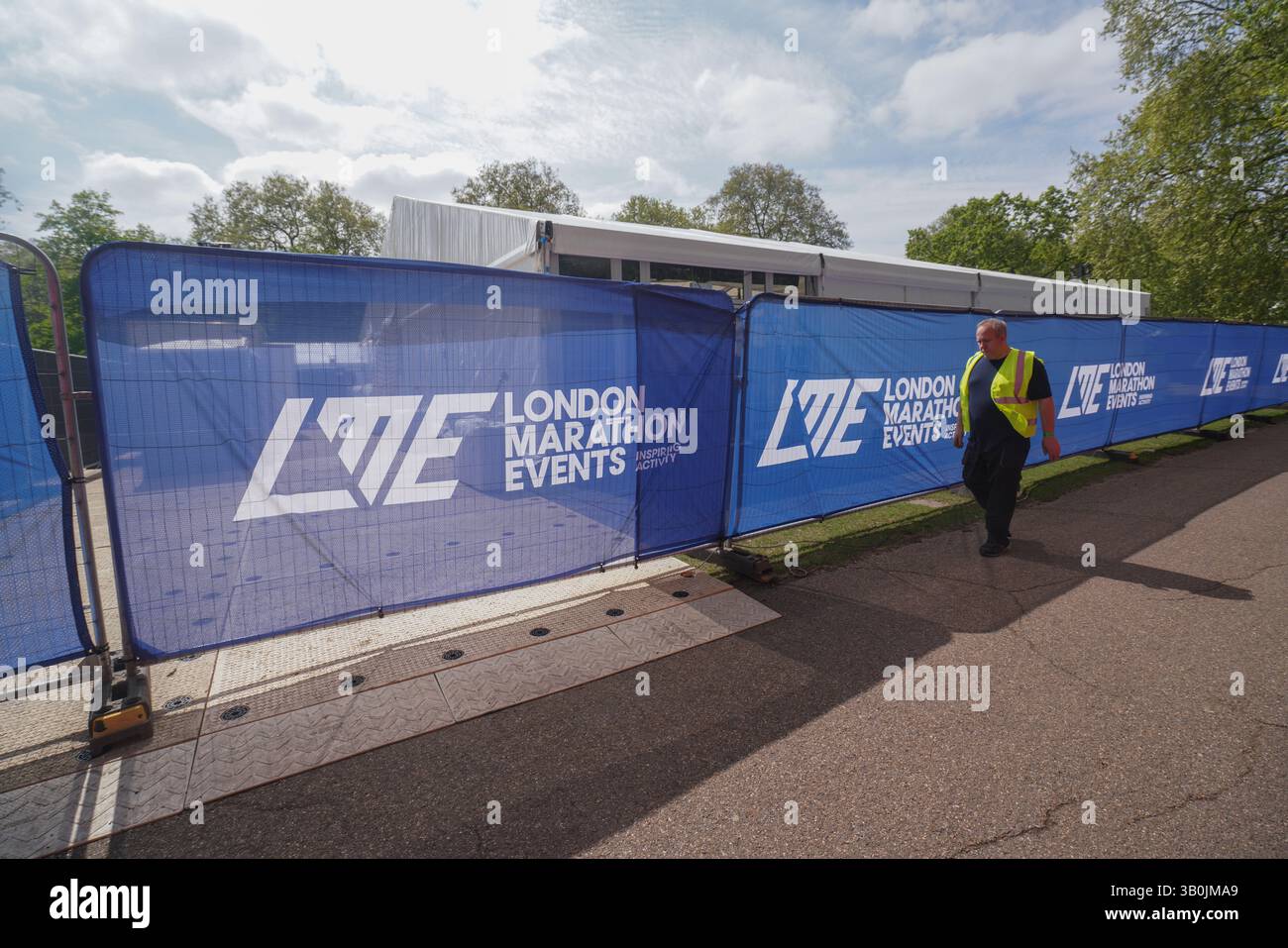 London UK 24 April 2025. Hoardings are displayed along The Mall for the ...