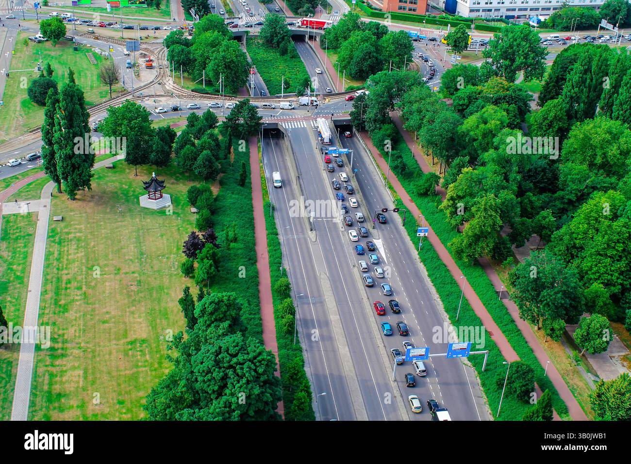 Aerial view of a busy urban highway with traffic, surrounded by ...