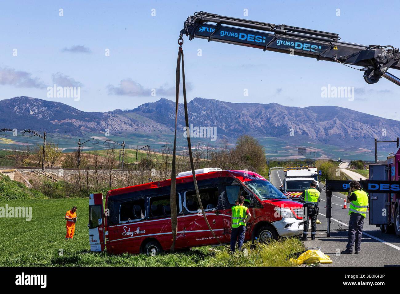 A crane lifts the crashed minibus, on April 24, in Berzosa de Bureba ...