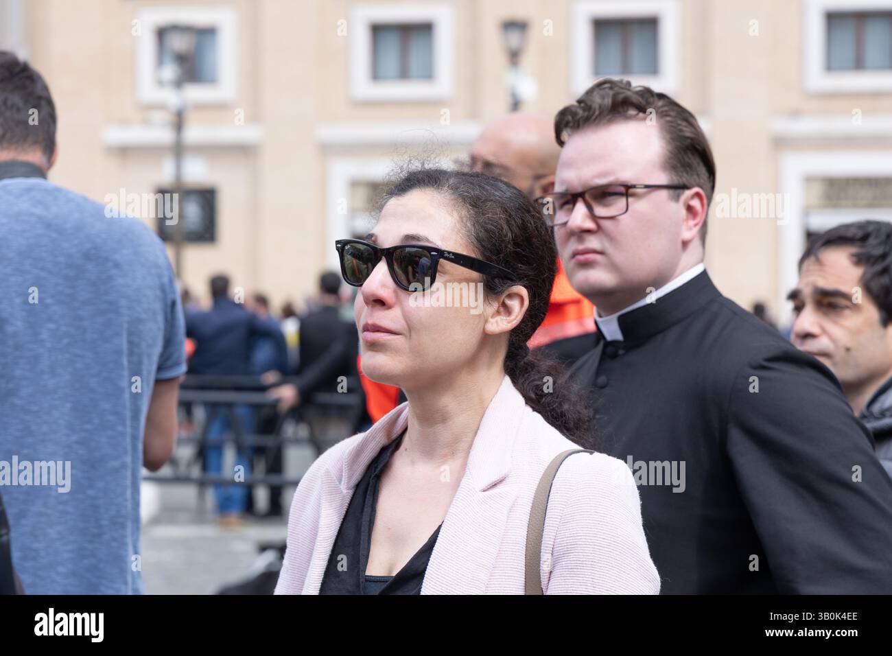 Rome, Italy. 24th Apr, 2025. Tearful woman in line near St. Peter's ...