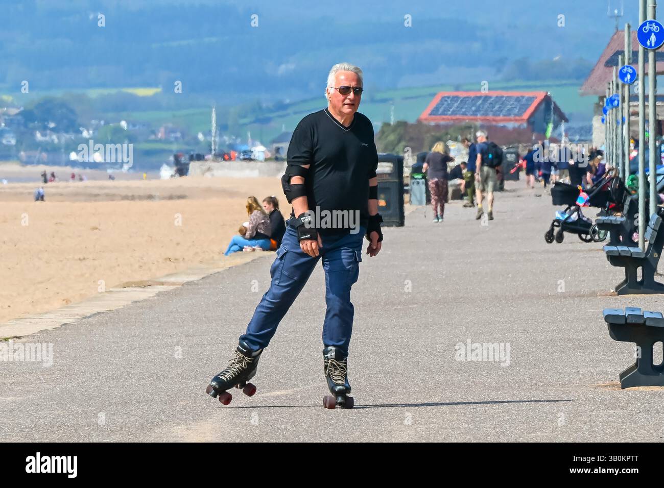 Exmouth, Devon, UK. 24th April 2025. UK Weather: A roller skater on the ...
