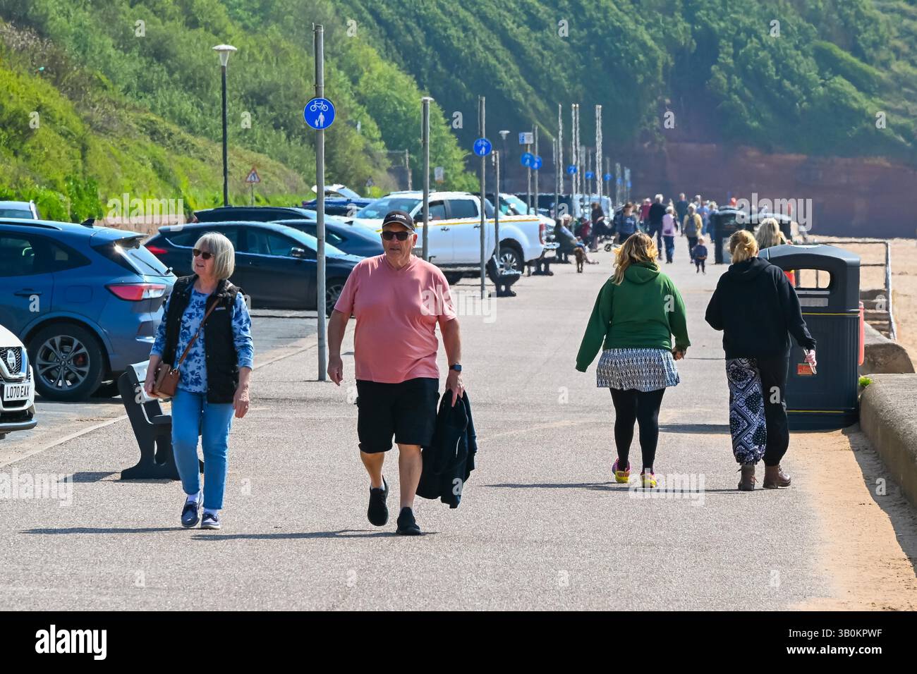 Exmouth, Devon, UK. 24th April 2025. UK Weather: Walkers on the ...
