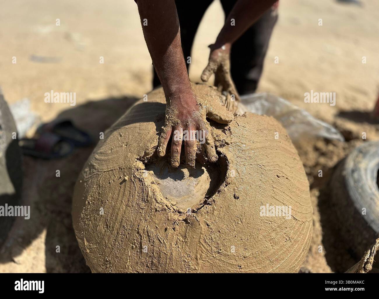 Clay ovens are manufactured for cooking due to the lack of cooking gas ...