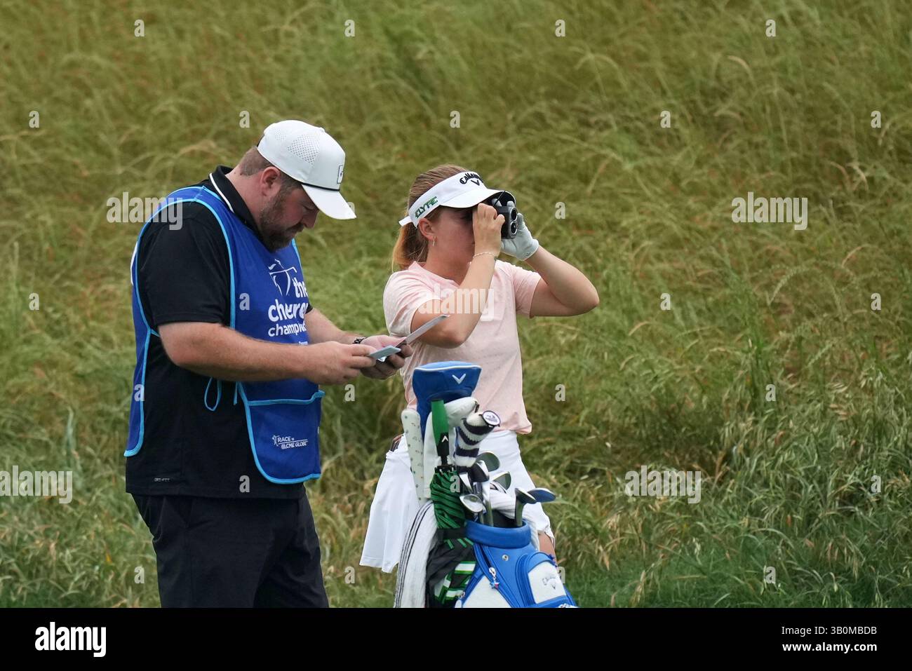 Carla Bernat Escuder, of Spain, uses a rangefinder on the first hole ...