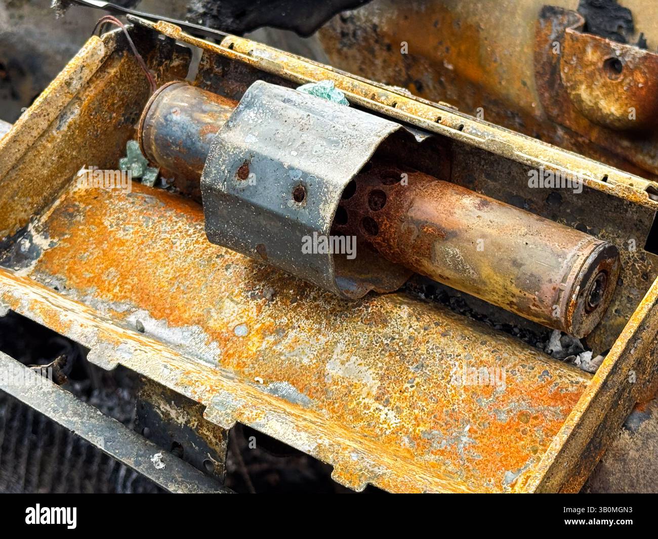 Burned steering column lock from a car with heavy rust and fire damage ...