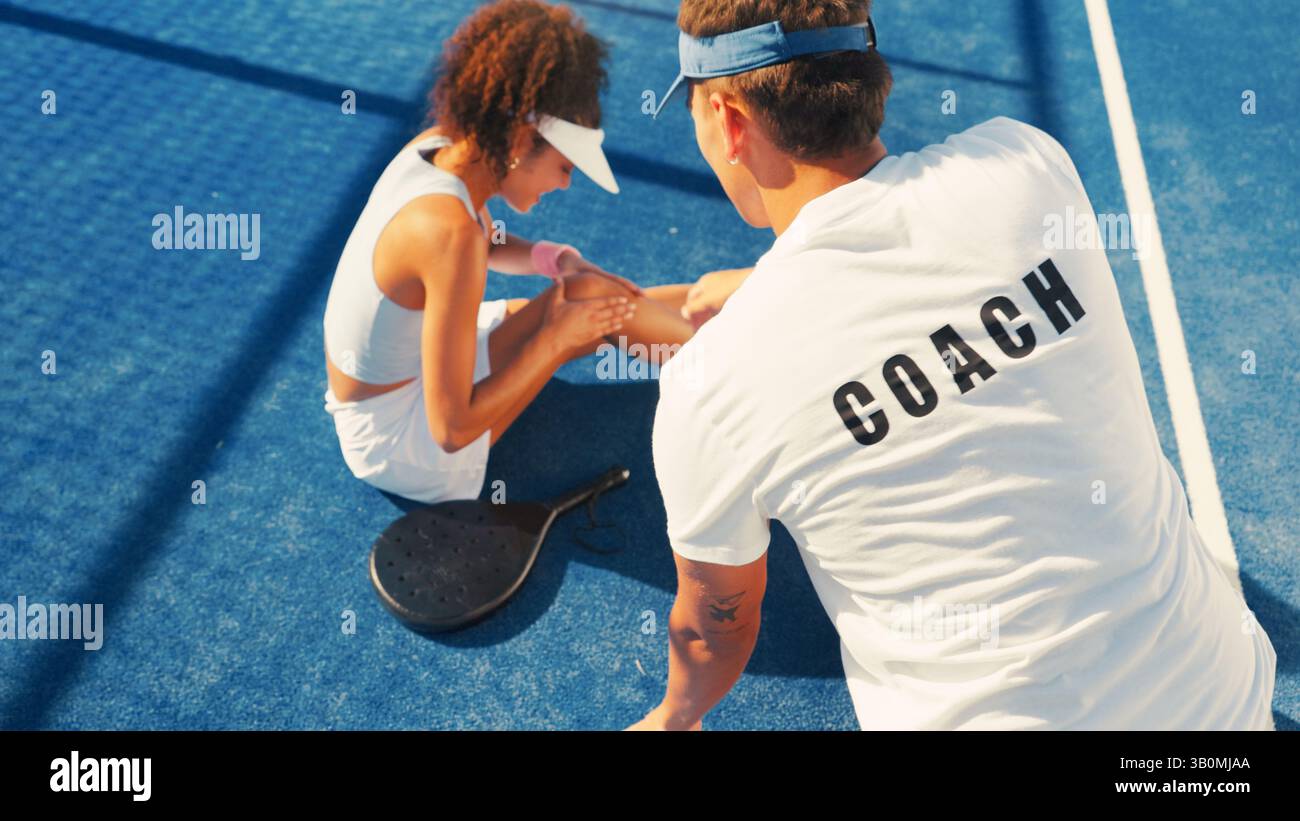 Woman, sport and knee injury with coach for pain, medical assistance or ...