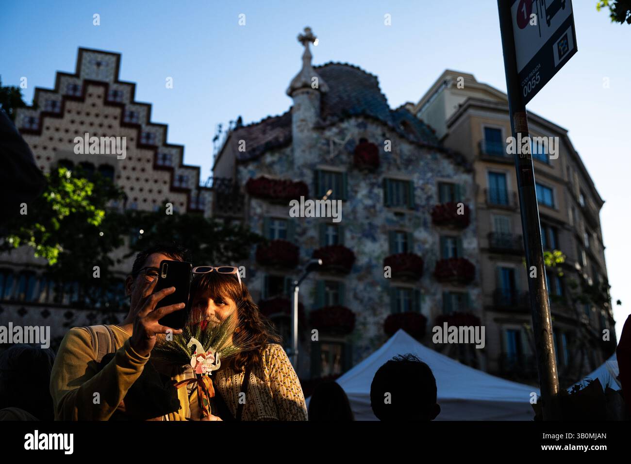 Sant Jordi festival in Barcelona A couple takes a selfie as part of ...