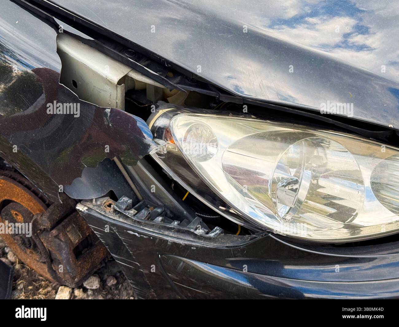 Broken front fender and headlight from a car showing cracked plastic ...