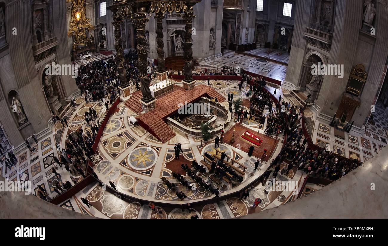 Vatican City, Vatican. 24th Apr, 2025. People pay their respects to late Pope Francis as he lies ...
