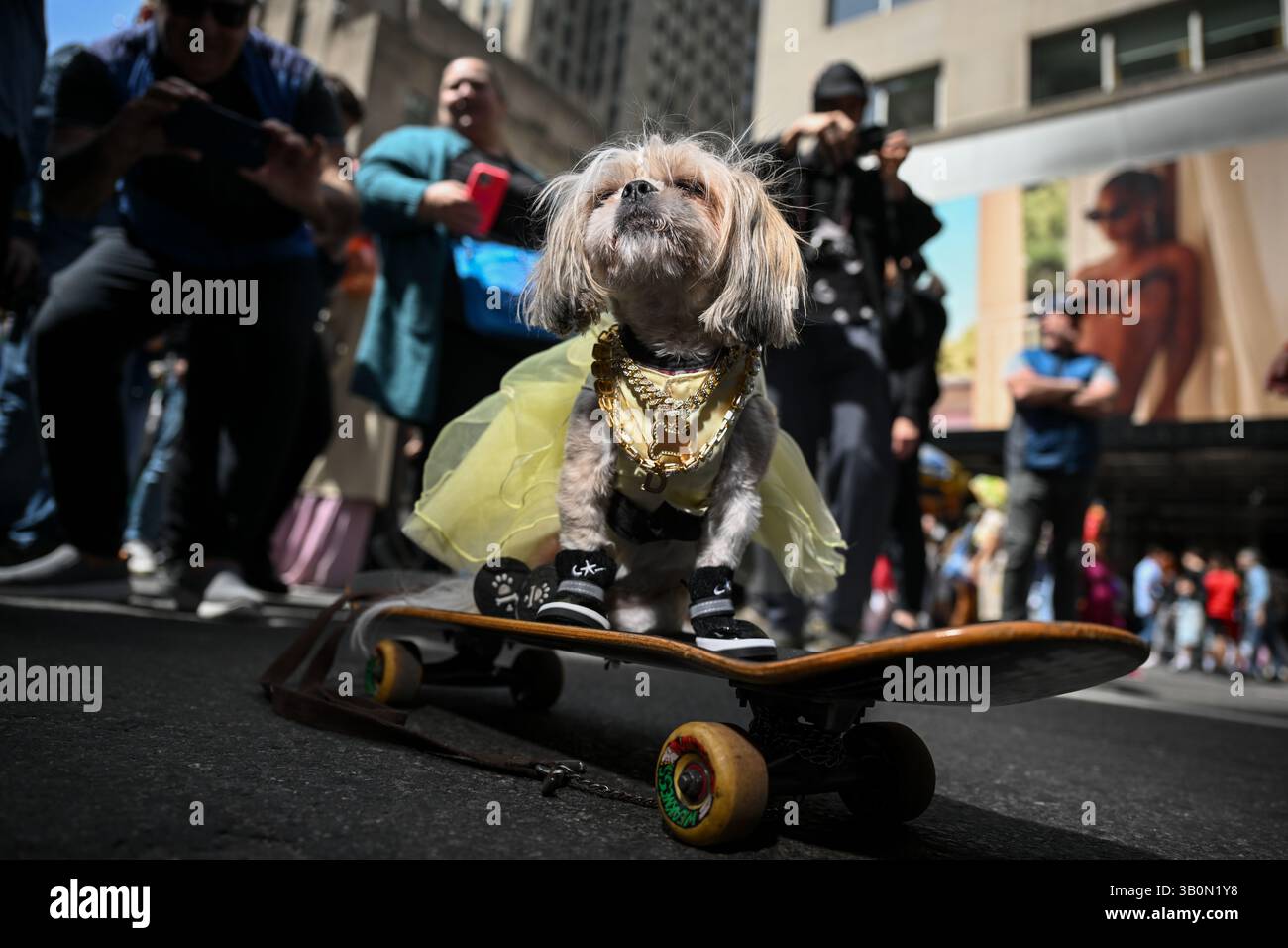 People dress in festive costumes during the Easter Parade and Bonnet ...