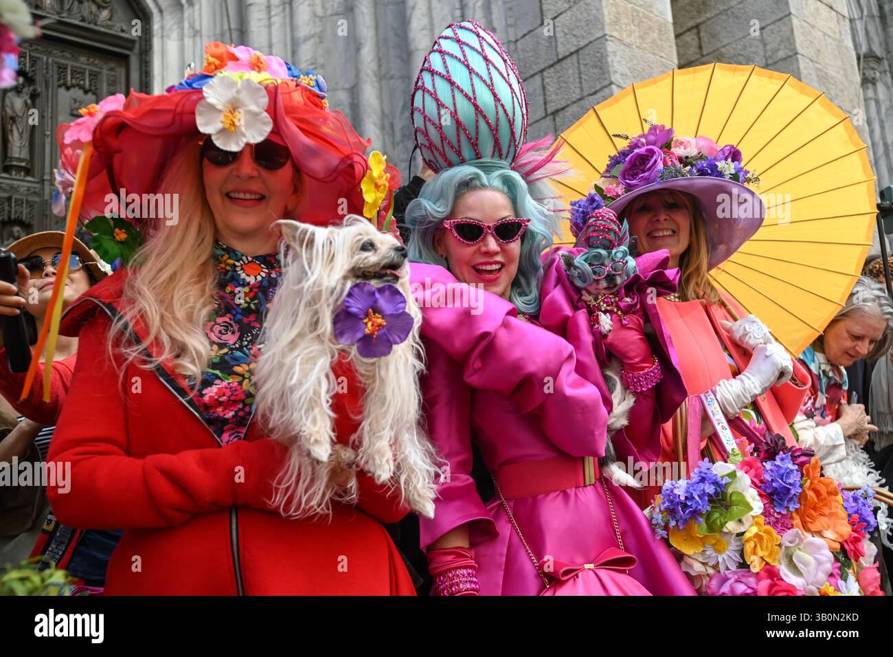 People dress in festive costumes during the Easter Parade and Bonnet ...