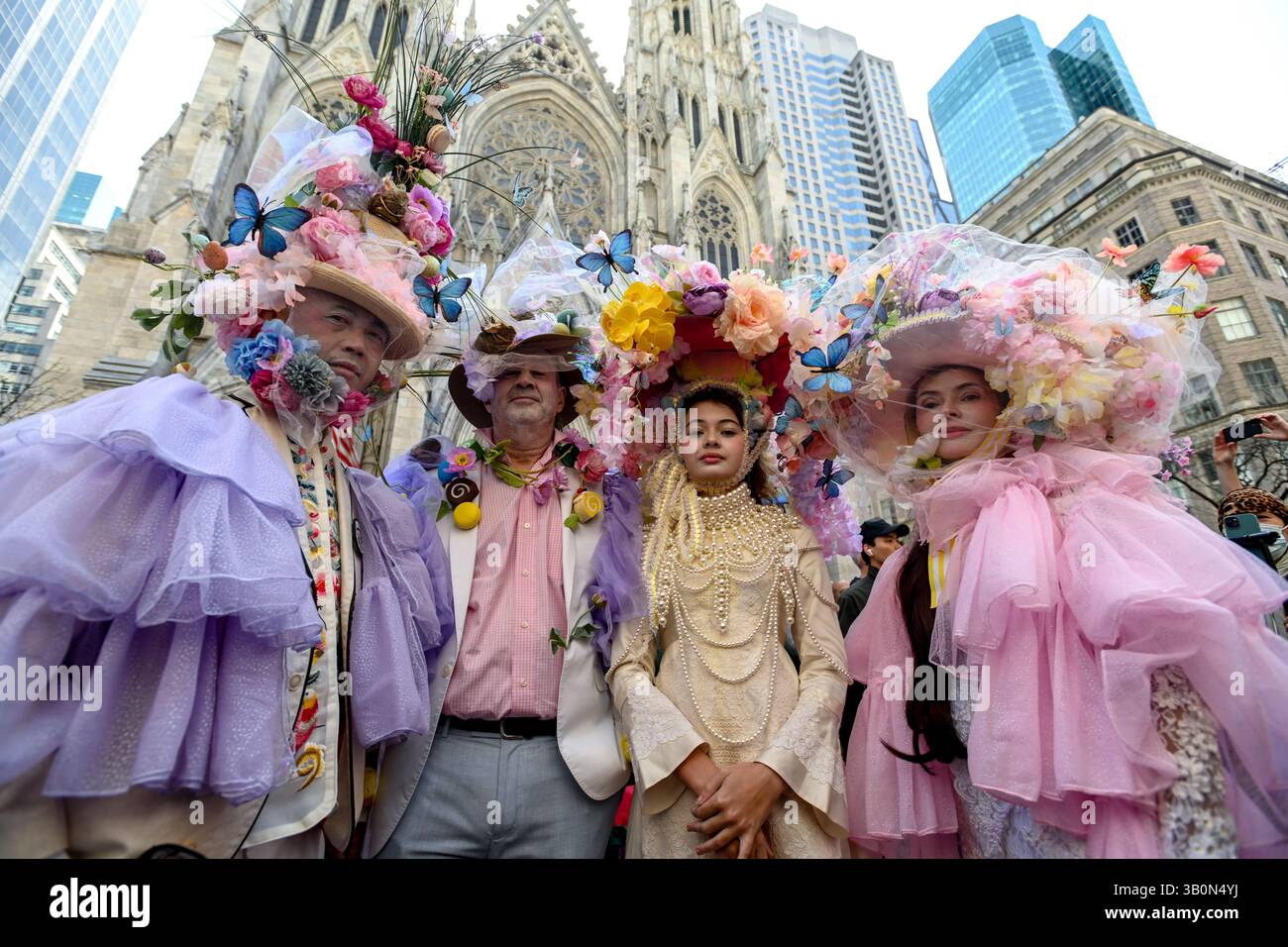 People dress in festive costumes during the Easter Parade and Bonnet ...