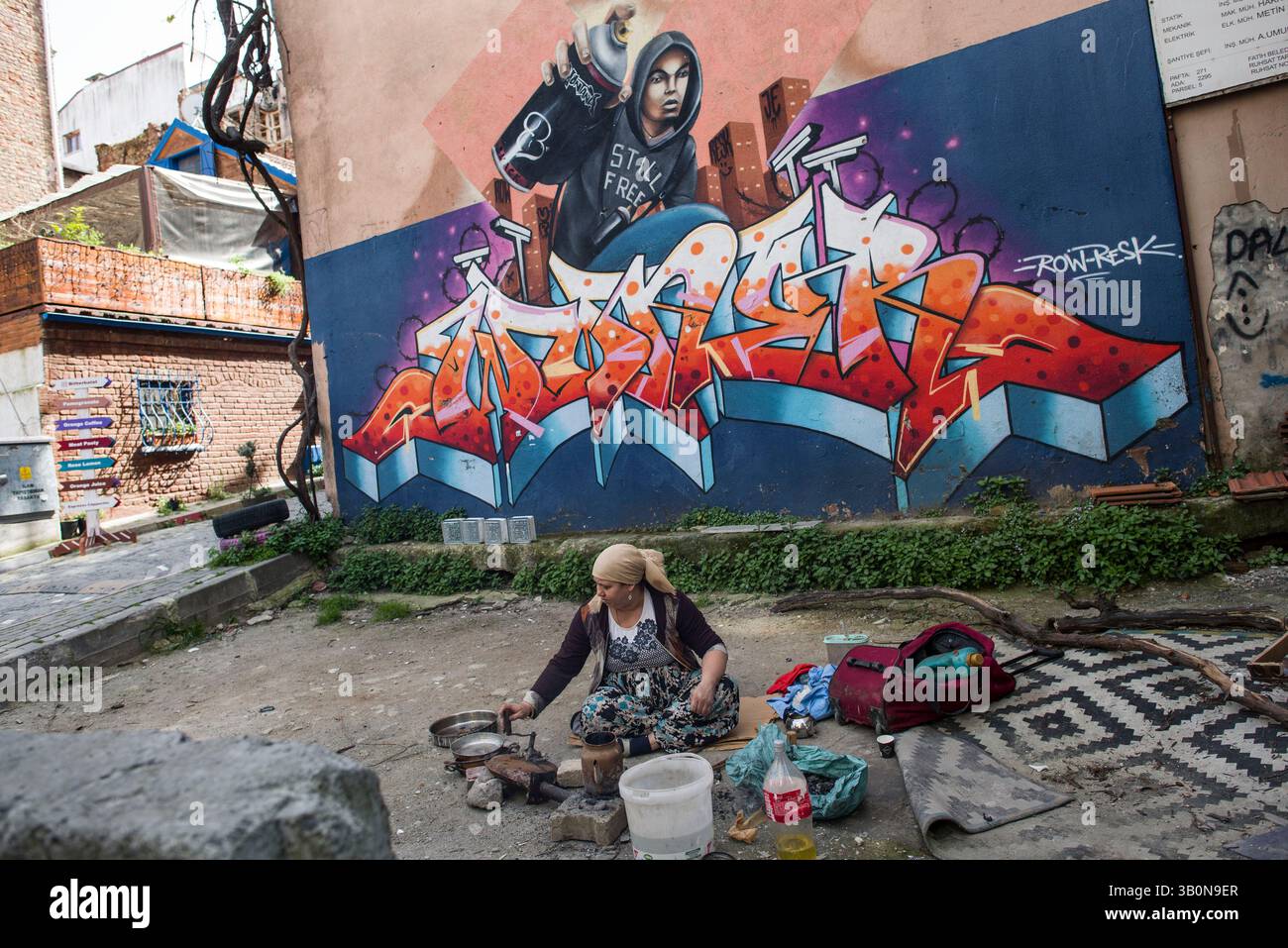 Istanbul, Turkey. 18th Apr, 2025. A homeless woman prepares tea on the ...