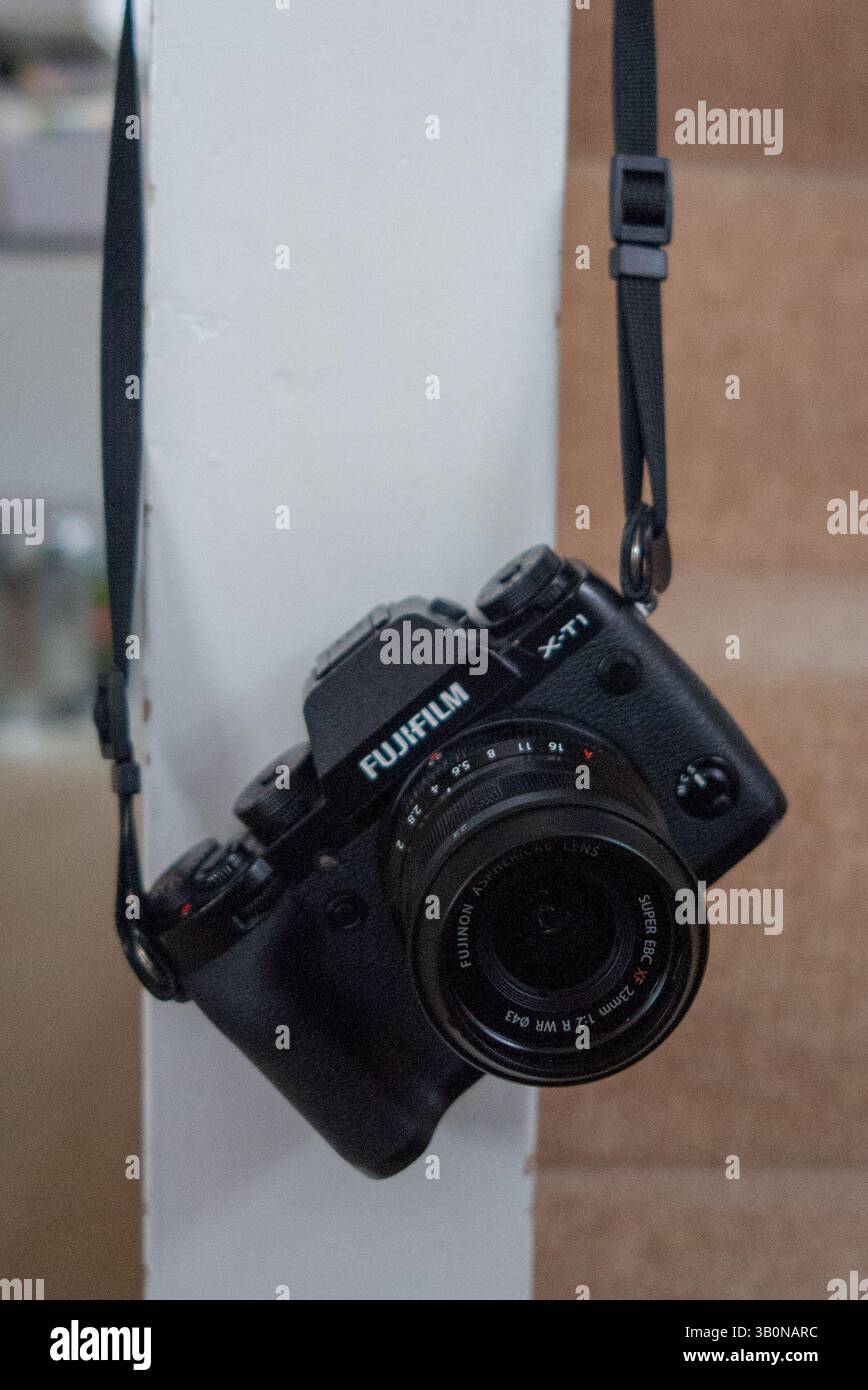 A Fujifilm X-T1 camera hangs from a strap, ready to capture the next ...